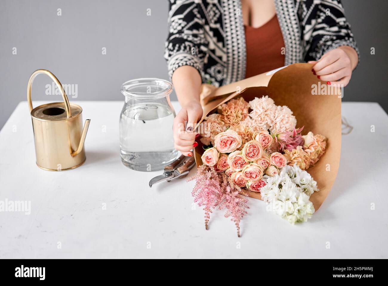Step by step installation of flowers in a vase. Flowers bunch, set for ...