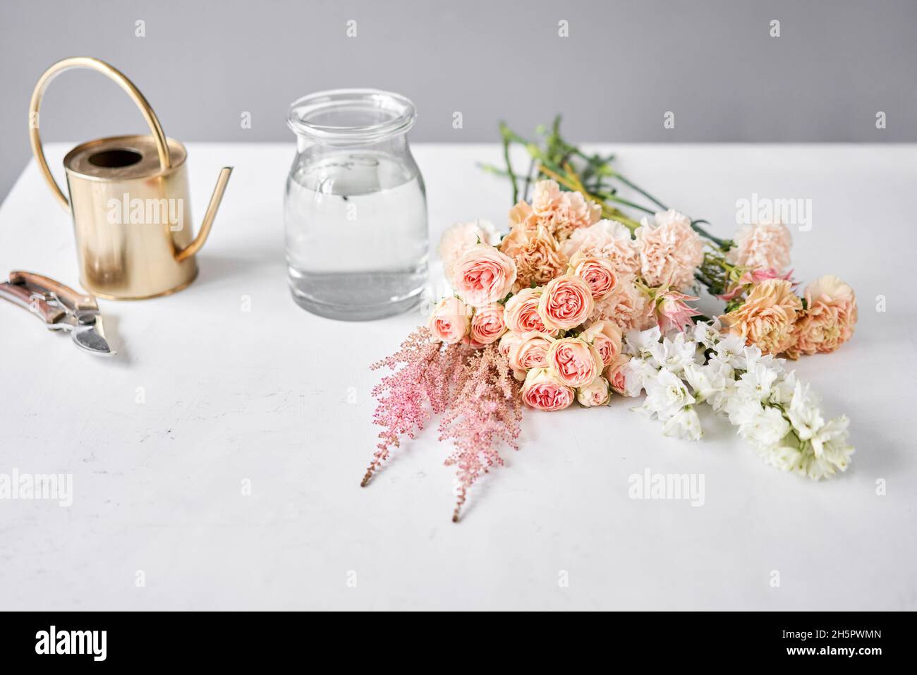 Step by step installation of flowers in a vase. Flowers bunch, set for ...