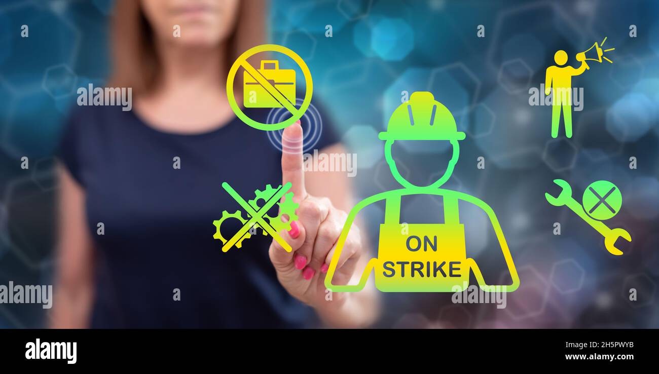 Woman touching a strike concept on a touch screen with her finger Stock ...