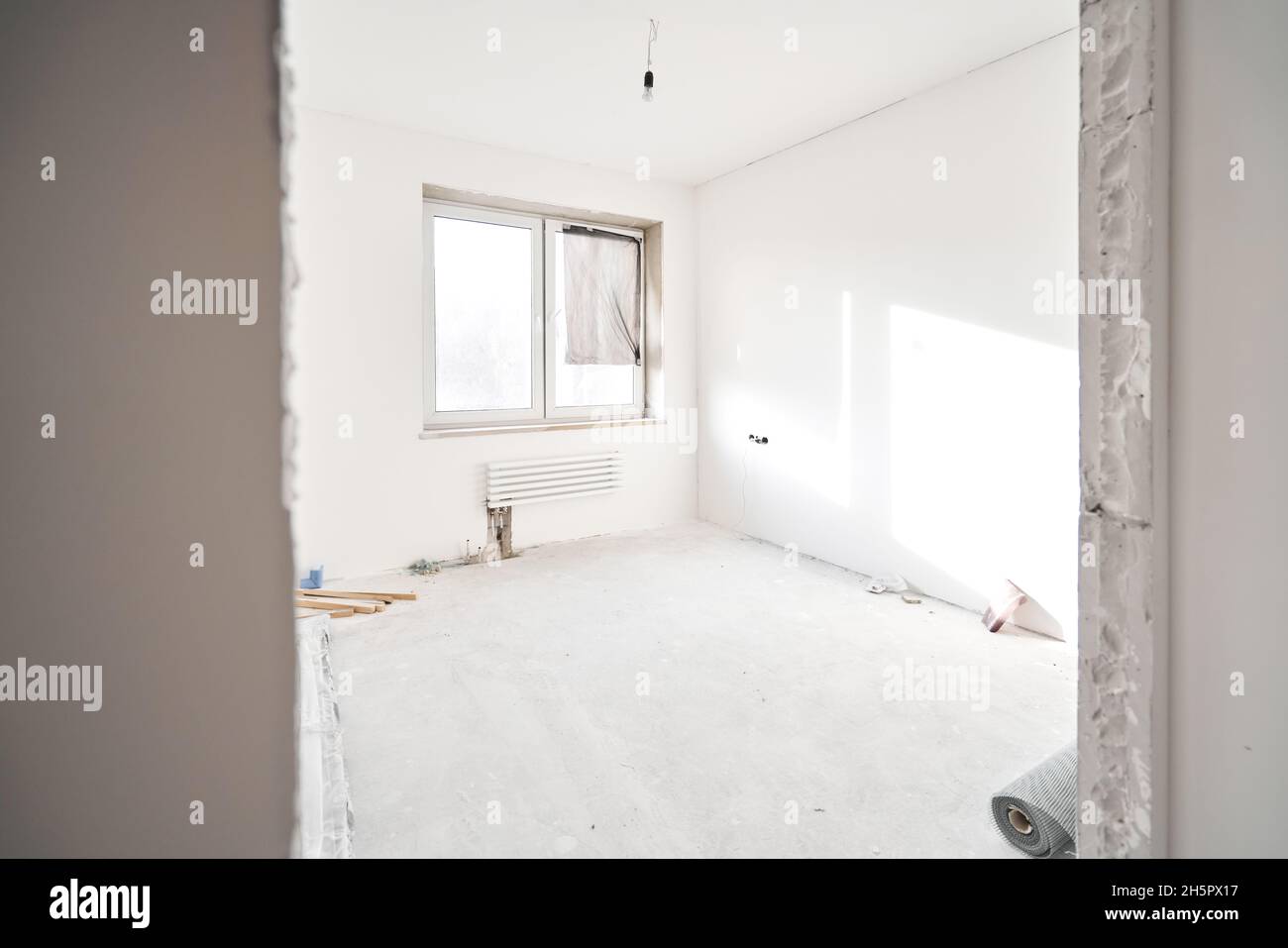 connection heating pipes to white Radiator in a new apartment under ...