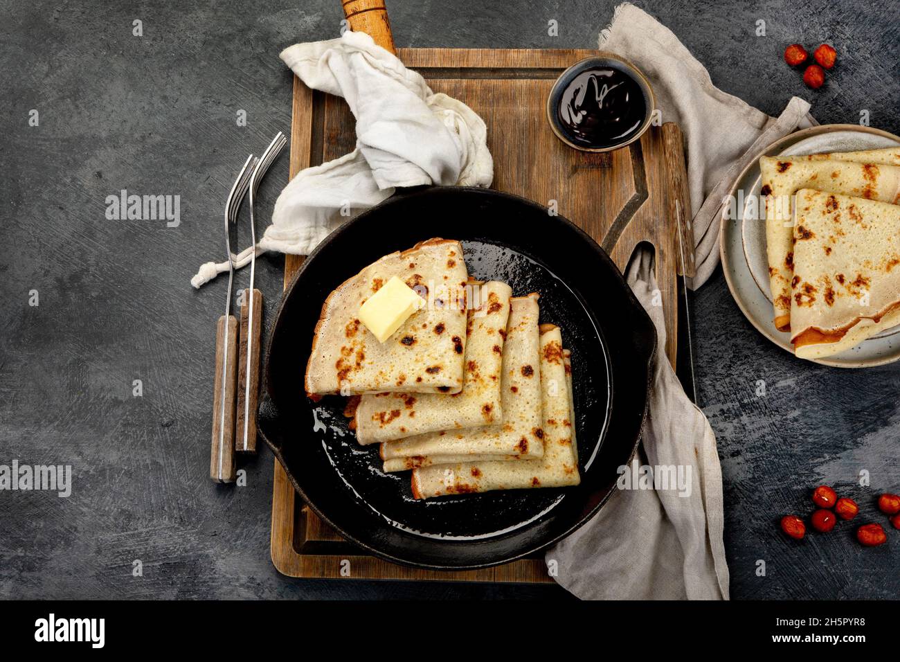 Crepes with sweet toppings on dark background. Homemade food concept ...