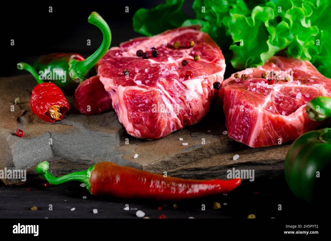 Food set for a picnic. Beef steaks ribeye ready to cook at barbecue ...