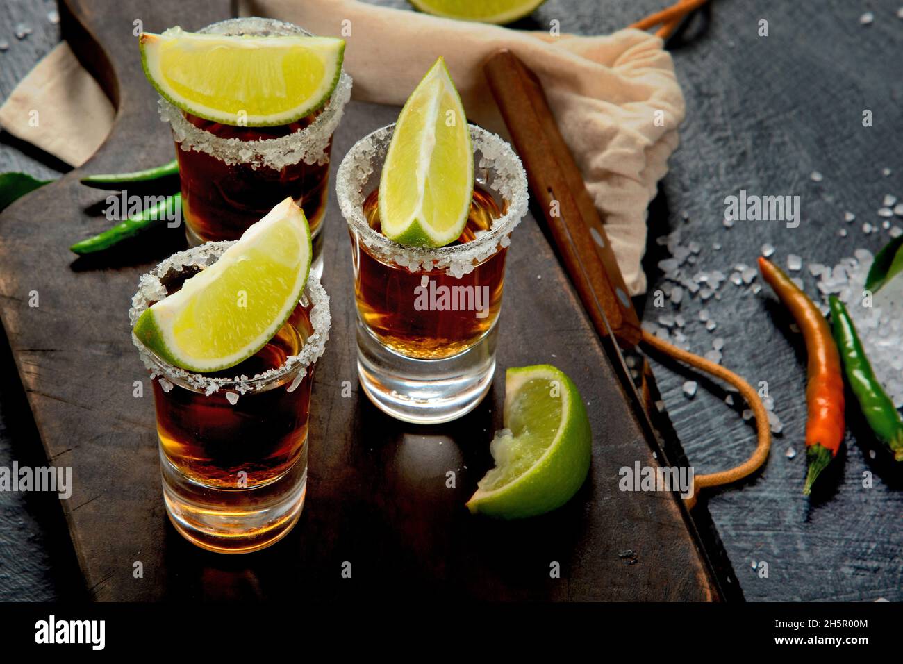 Tequila shots with lime and salt on gray background. Classic bar menu ...