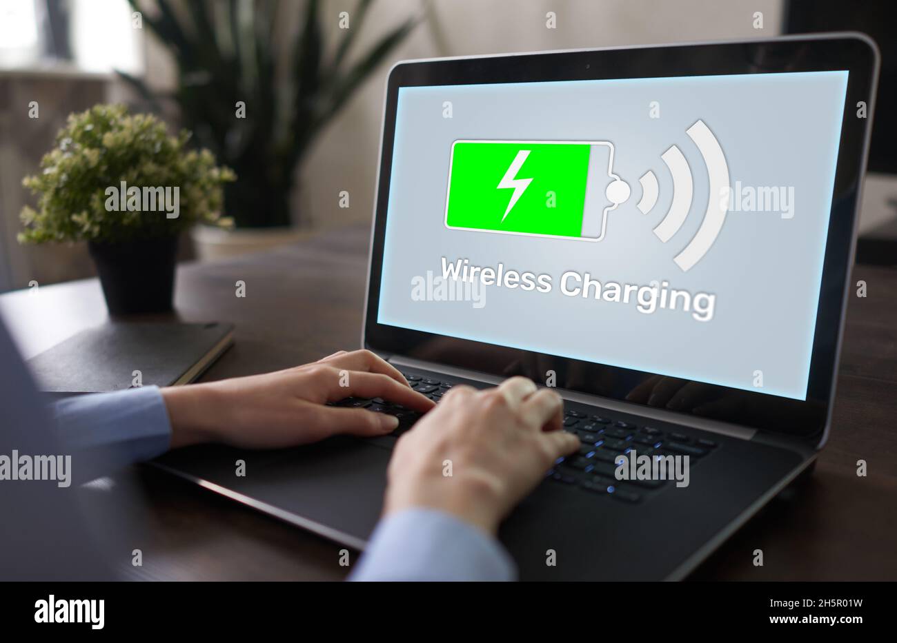 Wireless charging icons and progress bar on device screen Stock Photo ...