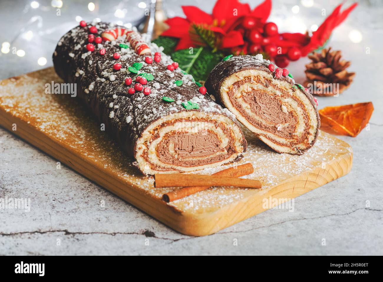 Christmas dessert concept. Christmas Chocolate yule log with Christmas ...