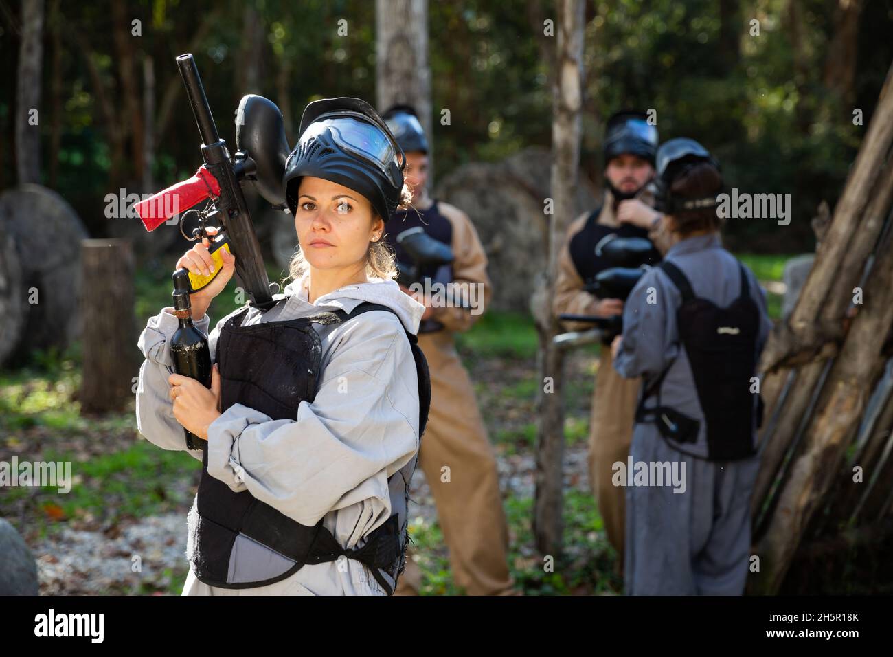 Portrait of young woman paintball player Stock Photo - Alamy