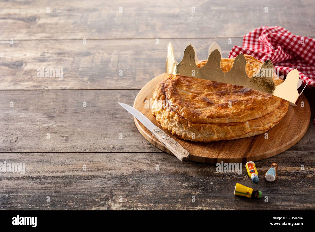 Galette des rois on wooden table. Traditional Epiphany cake in France ...