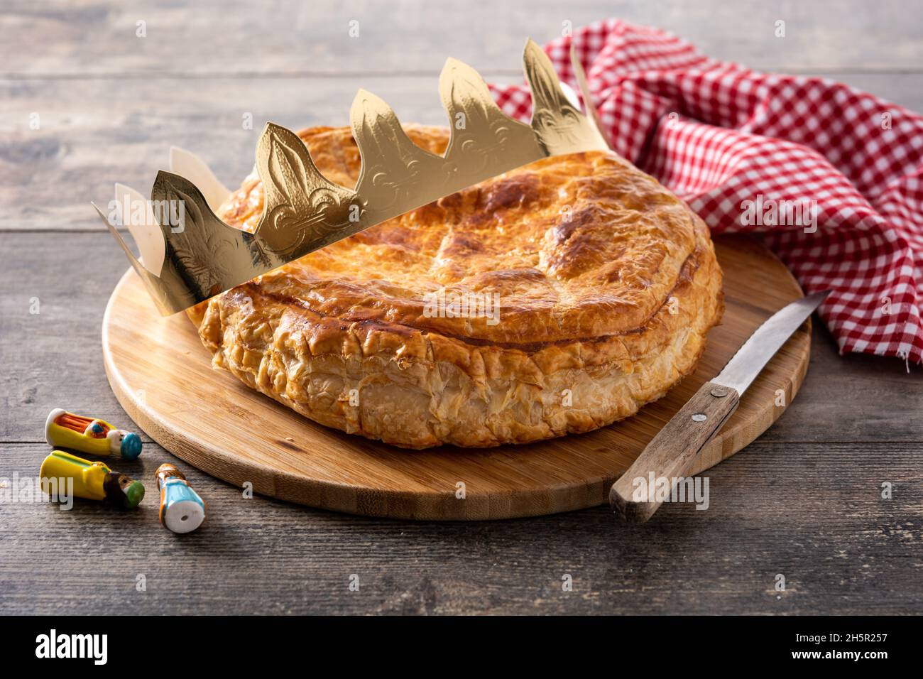 Galette des rois on wooden table. Traditional Epiphany cake in France ...