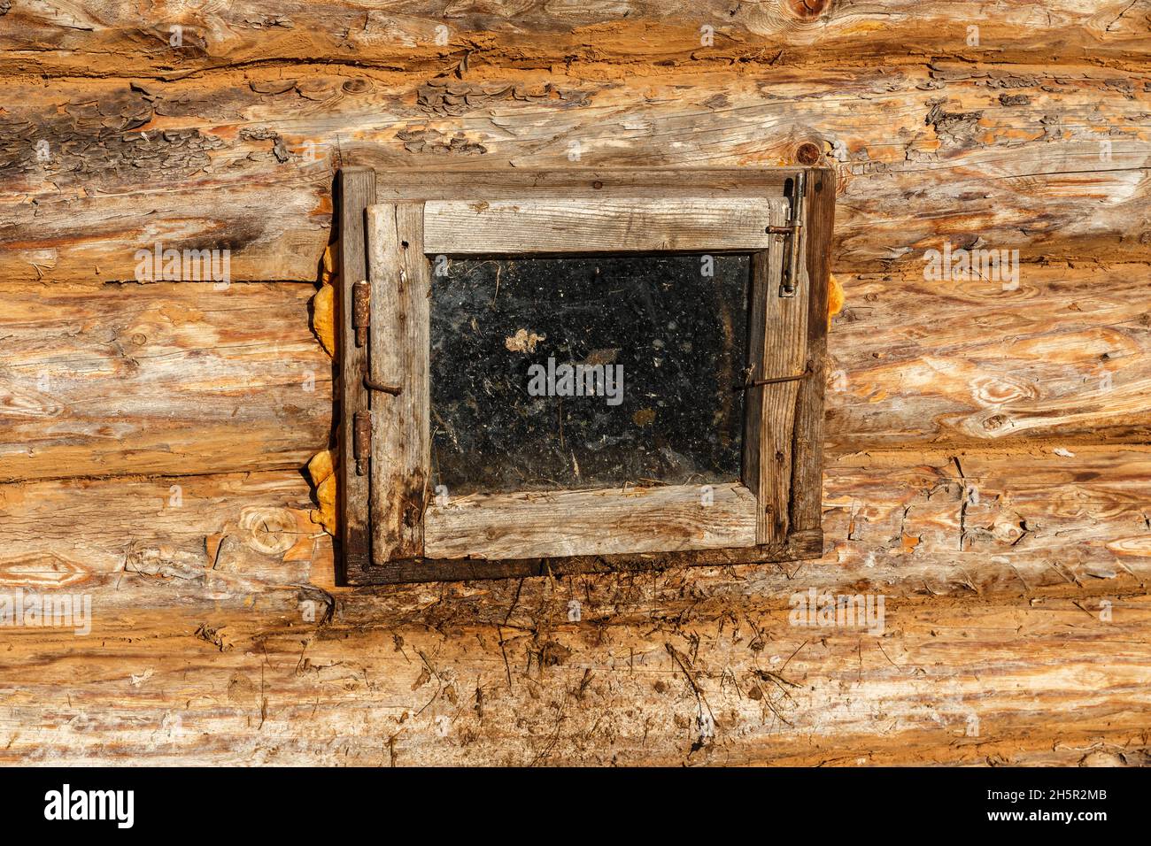 small window in a log wall. Shed for animals Stock Photo - Alamy