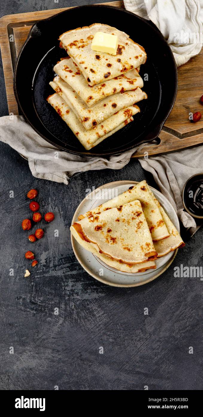 Crepes with sweet toppings on dark background. Homemade food concept ...