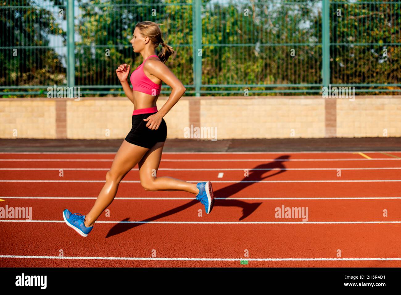 Side view beautiful young woman exercise jogging and running on ...