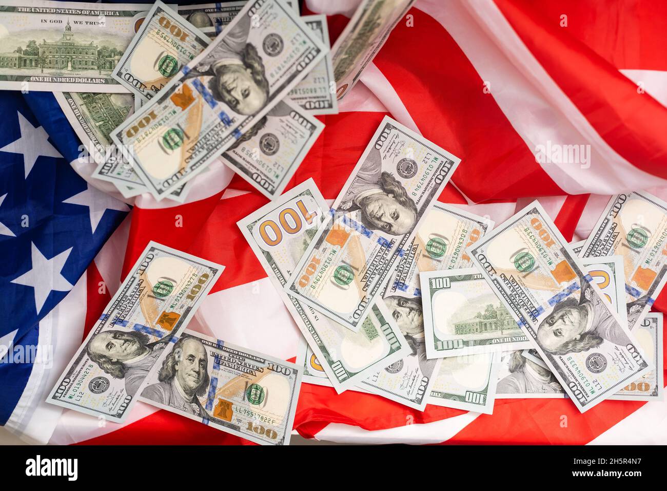 dollars on american flag, money Stock Photo - Alamy