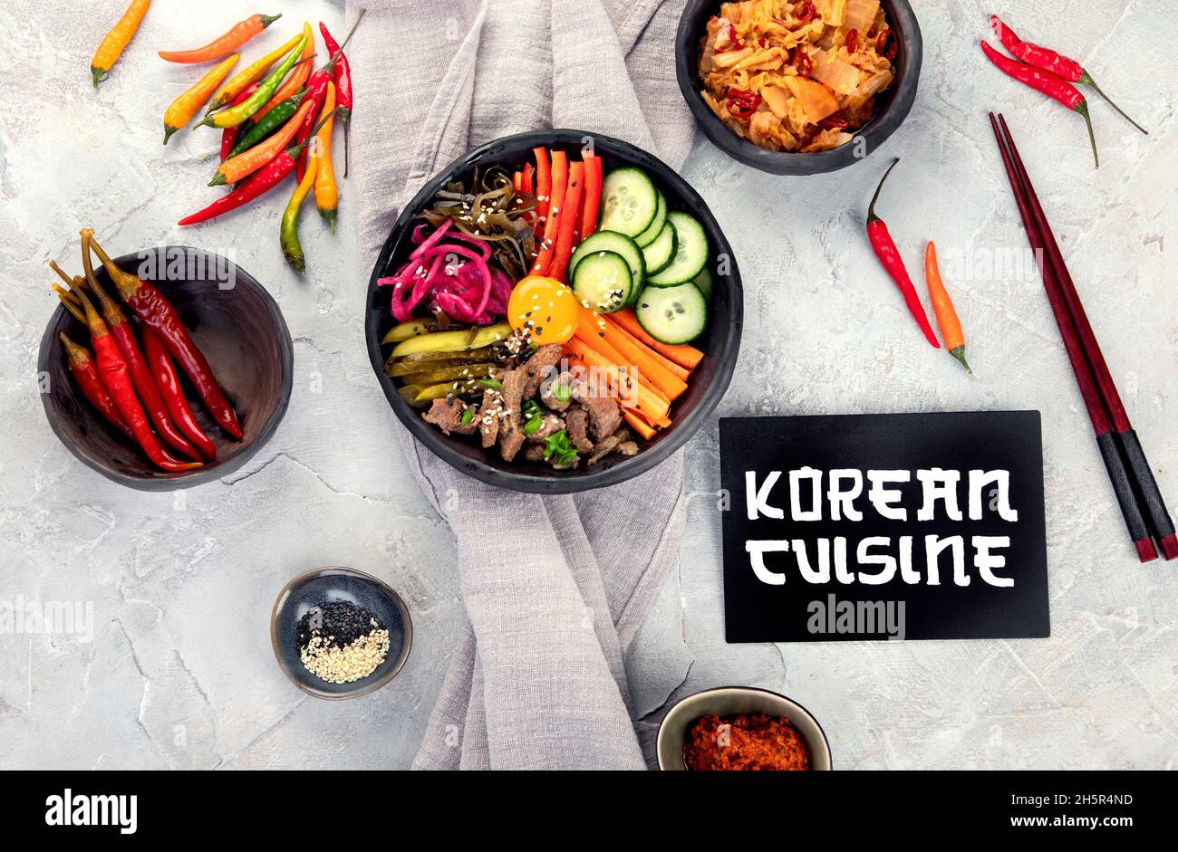 Bibimbap with snacks on gray background. Traditional Korean food. Top ...