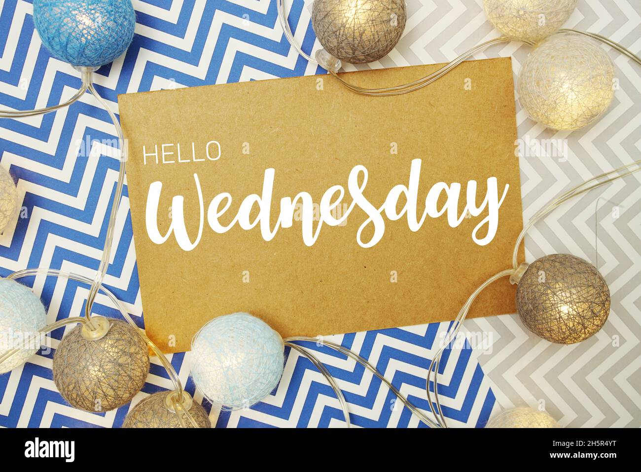 Hello Wednesday typography text on paper card with LED cotton balls ...