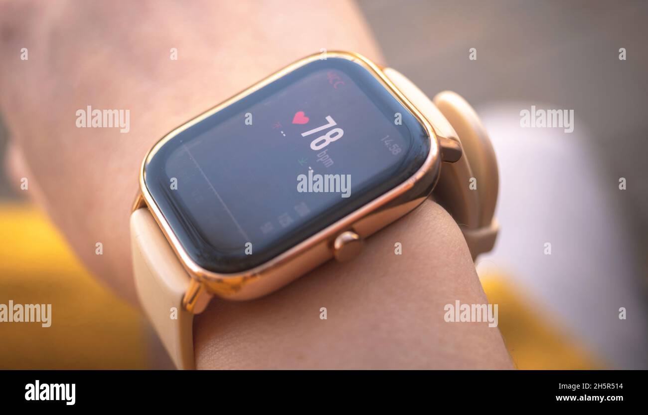 Woman measuring heart rate with application on smart watch, close-up ...