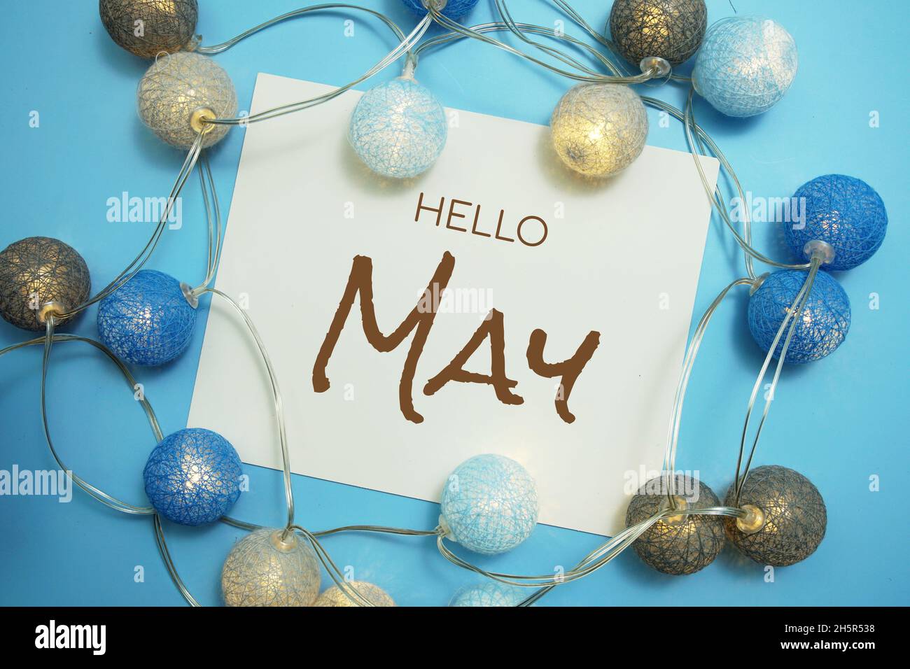 Hello May typography text with LED cotton ball on blue background Stock ...