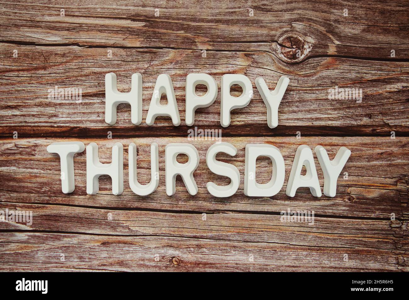 Happy Thursday text message on wooden background Stock Photo - Alamy