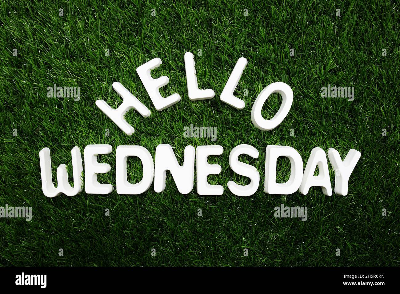 Hello Wednesday alphabet letter on green grass background Stock Photo ...