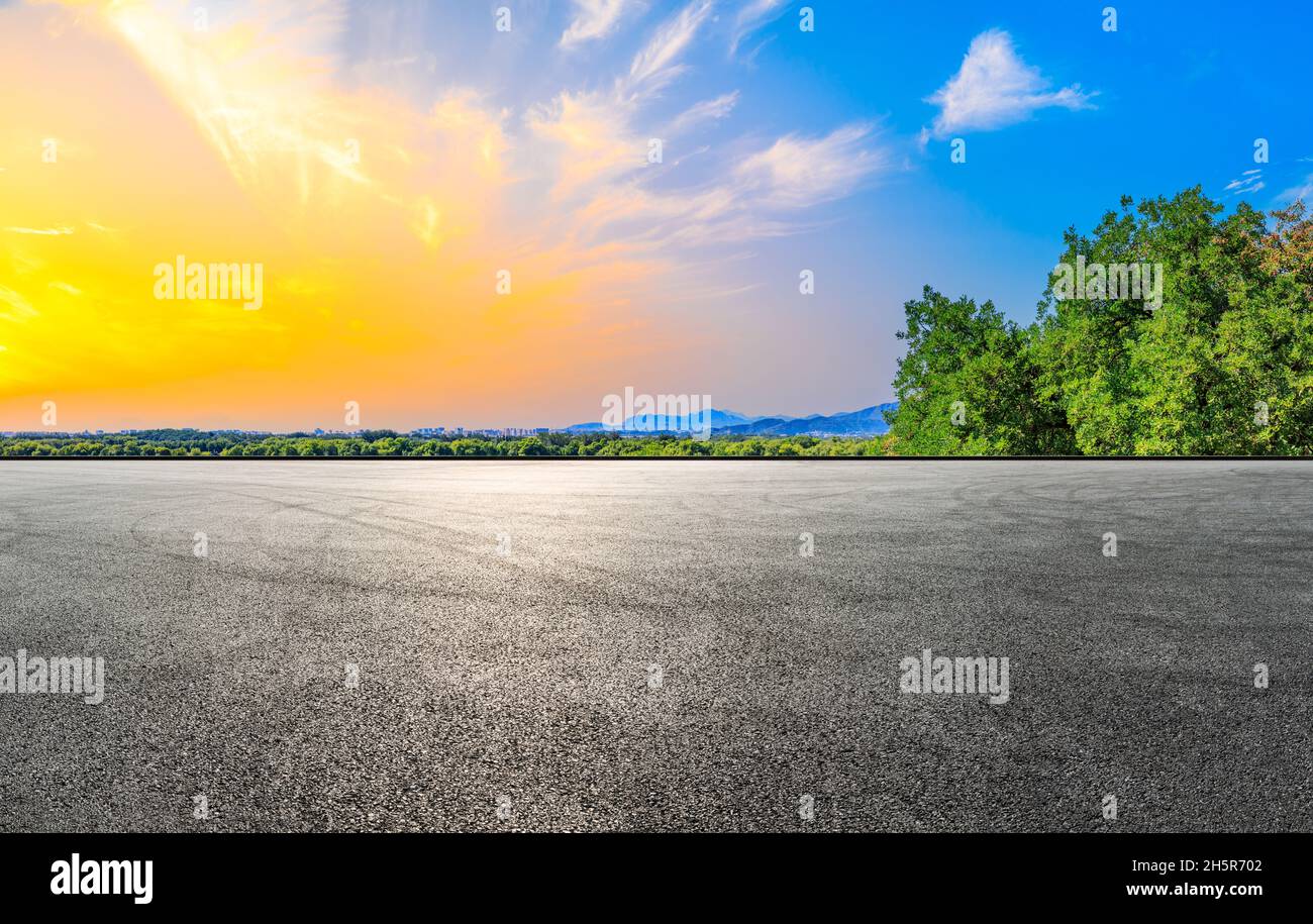 Empty racing track road and green forest with mountain landscape in the ...