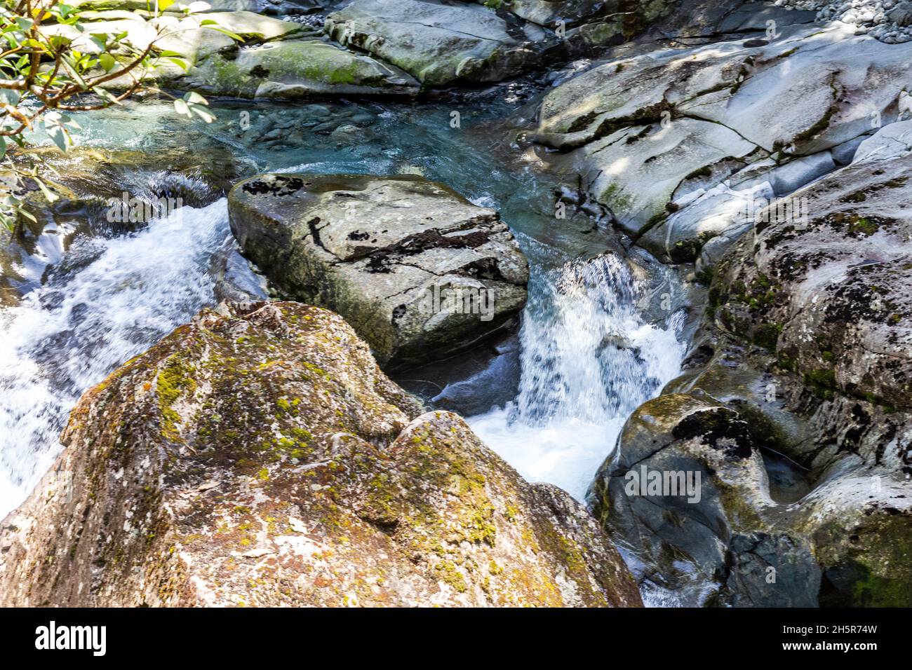 A stream disappearing into a funnel. Funnel Chasm in New Zealand ...