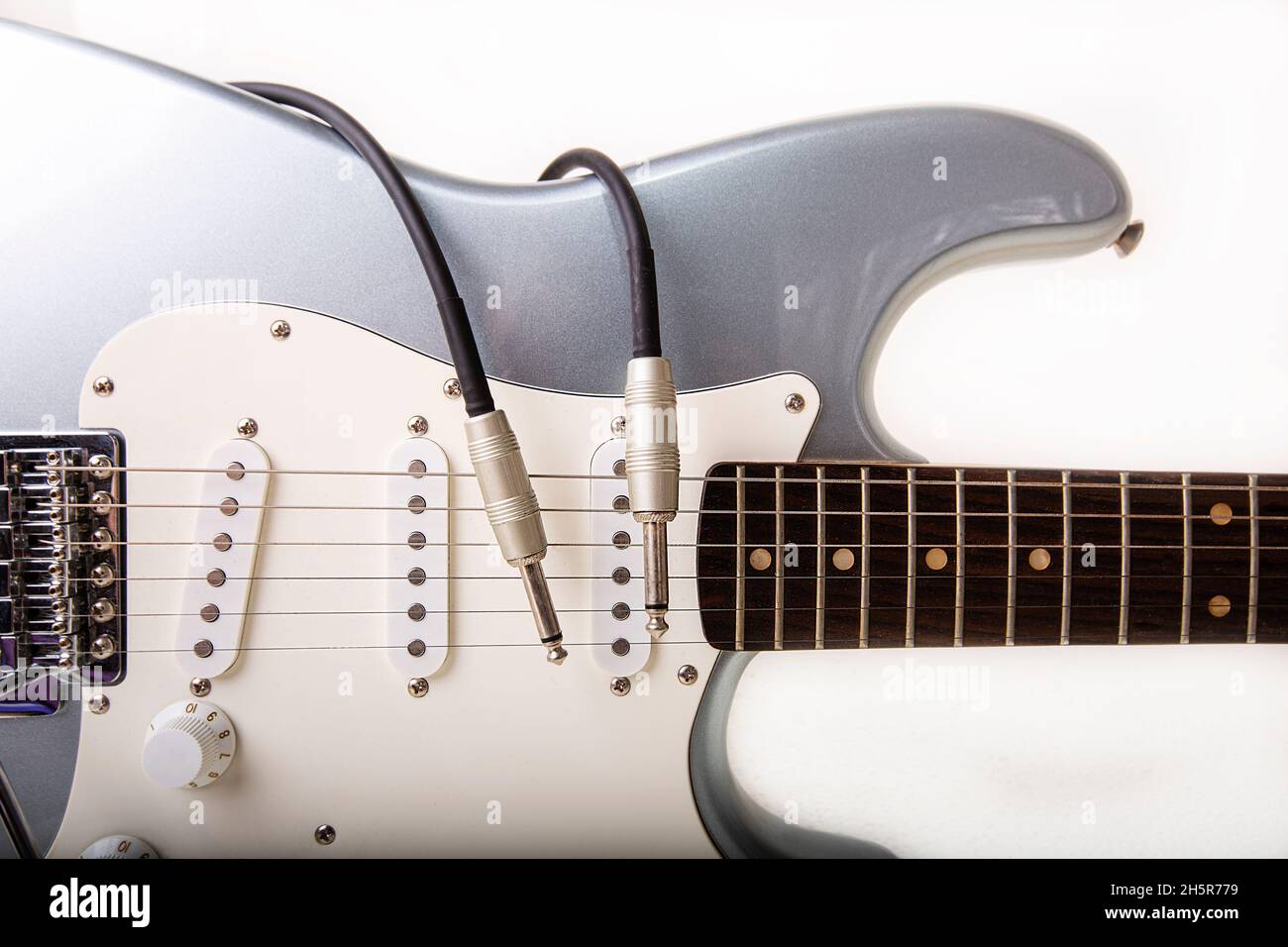 Silver electric guitar isolated on white background Stock Photo - Alamy
