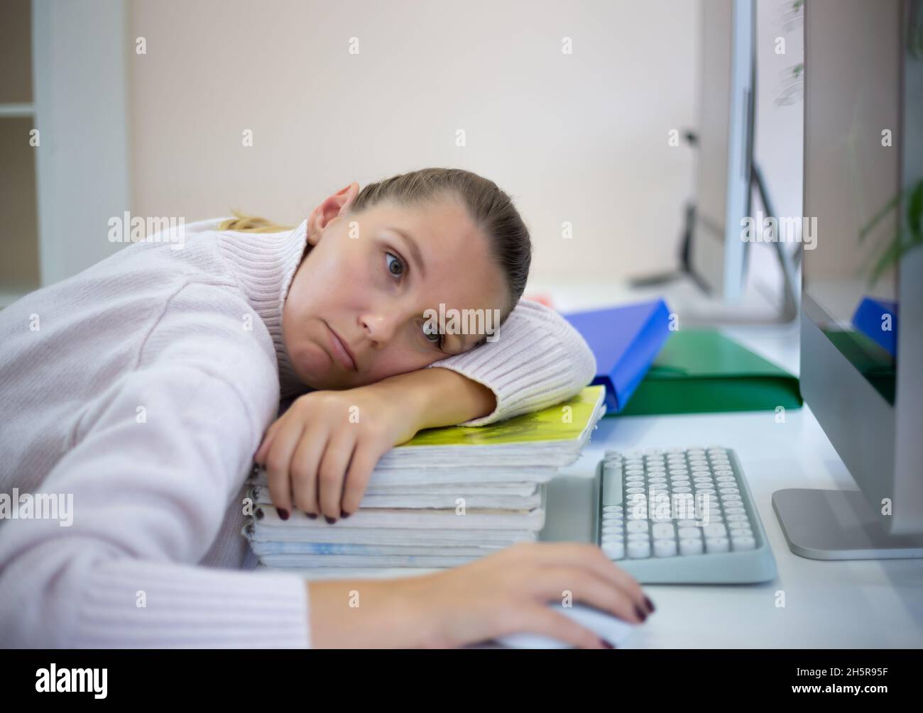 young woman is sad at the workplace. office work concep Stock Photo - Alamy