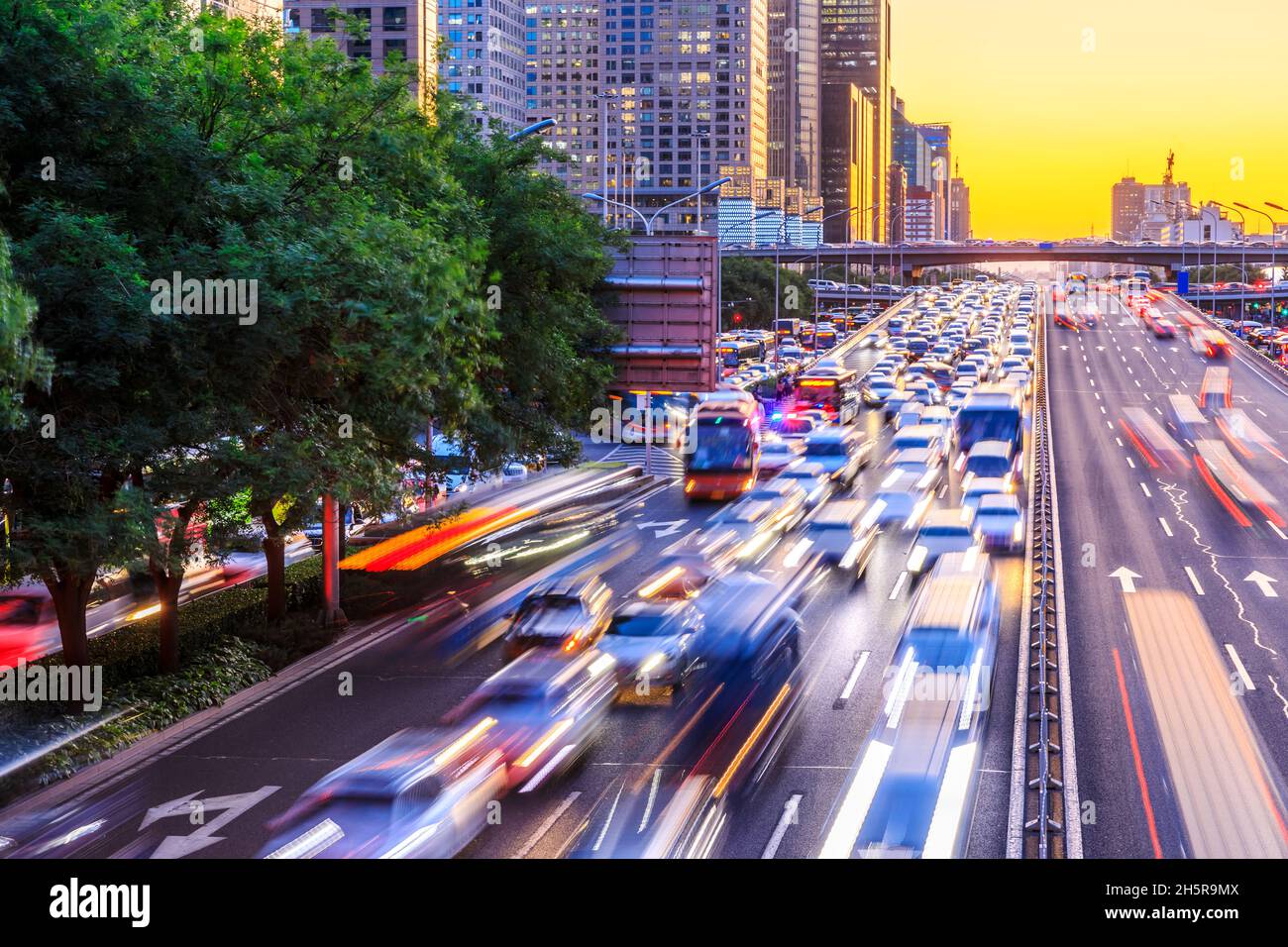 Busy city road and skyscraper buildings in Beijing at sunset,China ...