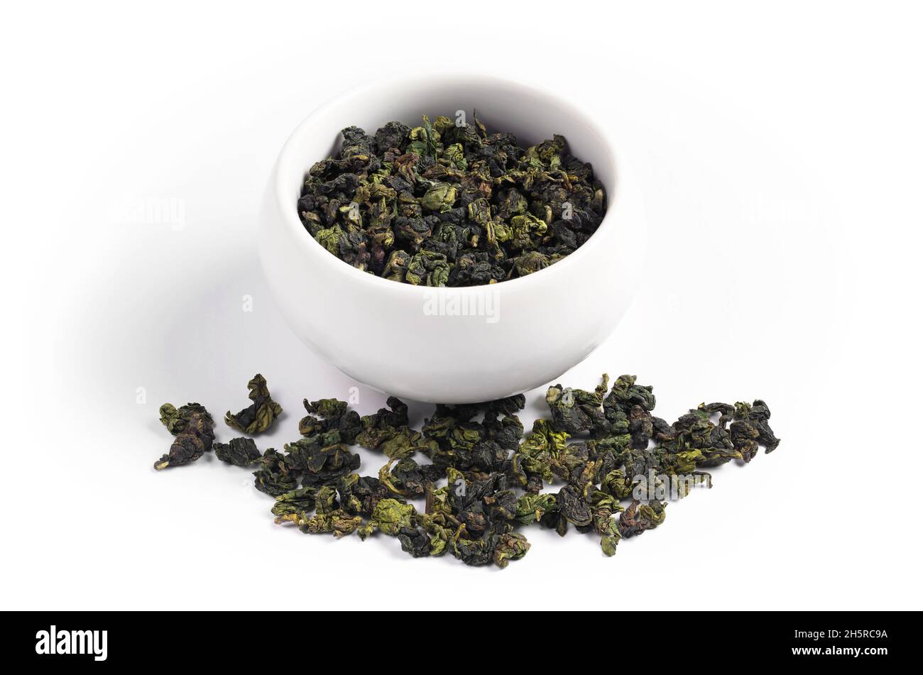 Traditional Chinese Oolong tea in cup and near, on white background ...