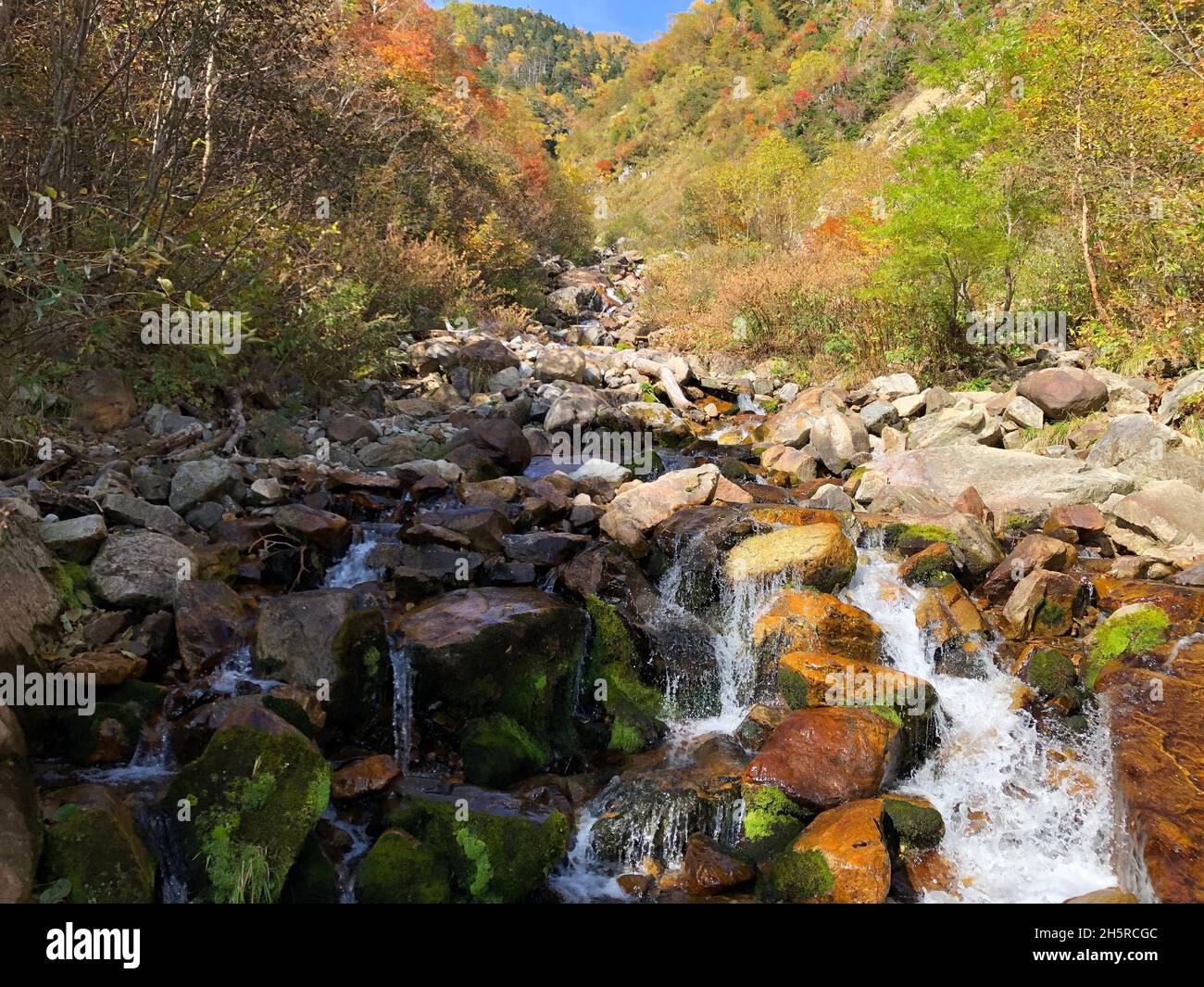 MOUNT JONEN. A mountain stream alongside a hiking route up to Mount ...