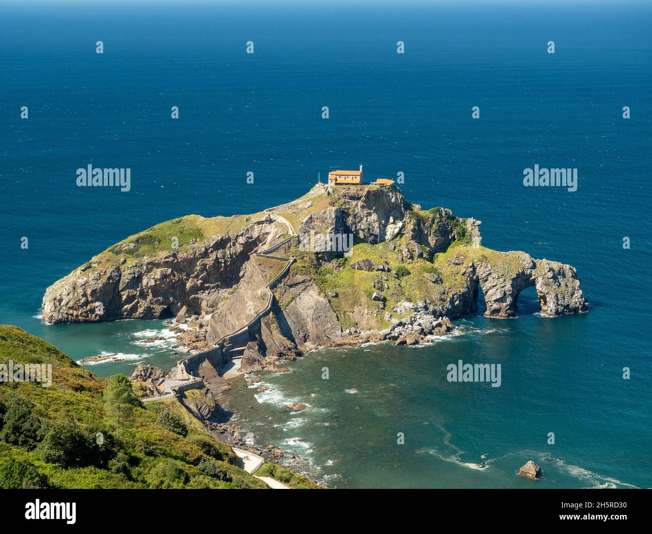 Landscape of the historic San Juan Gaztelugatxe fort surrounded by the ...