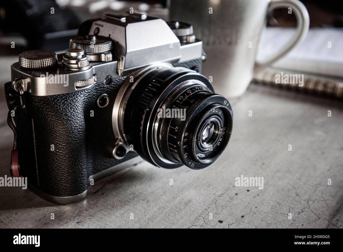 Antique old 50mm USSR lens from the 70s on a silver and black hybrid ...