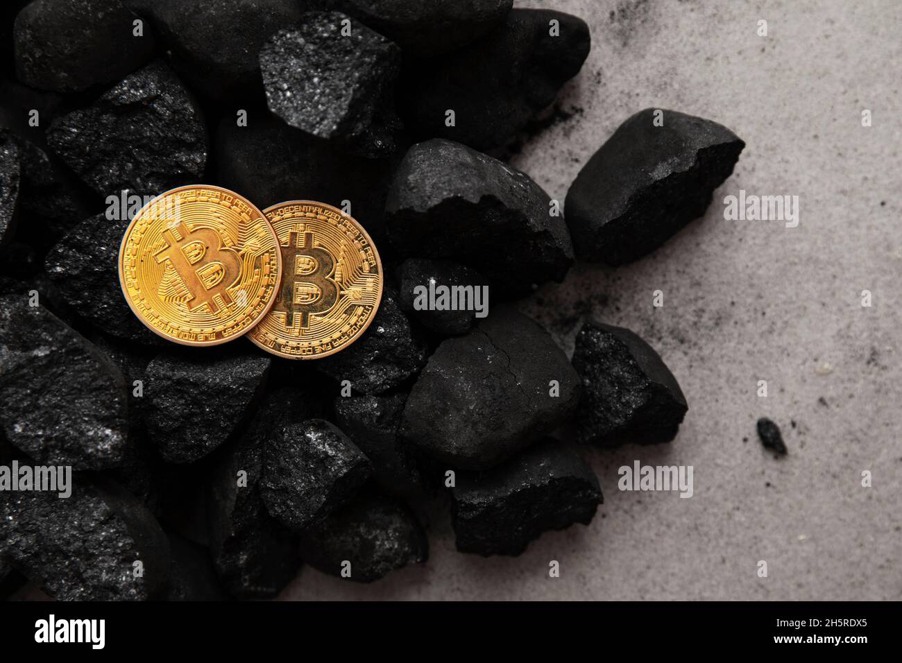 Bitcoin mining concept. Gold bitcoin cryptocurrency coin in a pile of ...