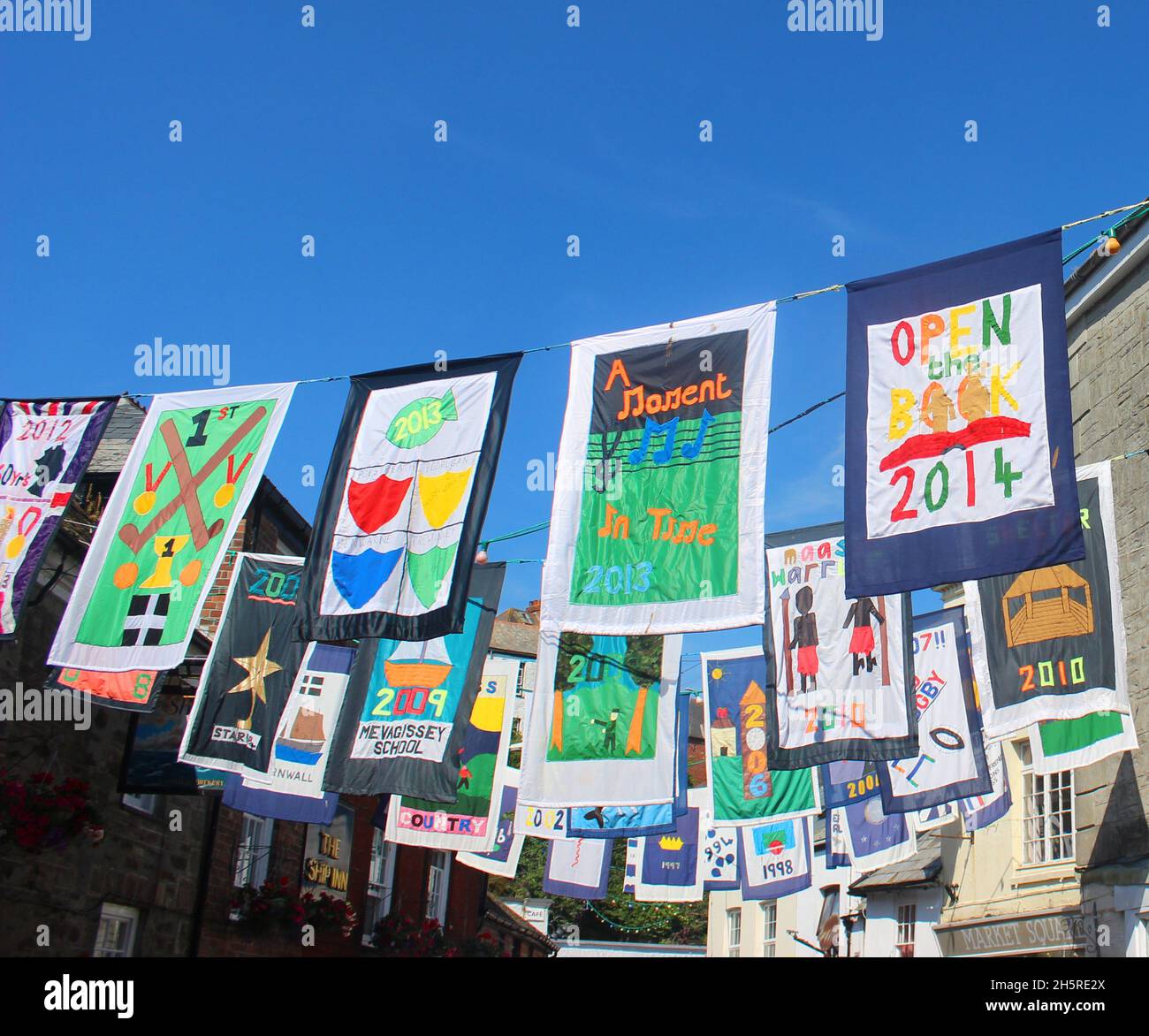 Colourful Feast Week flags and pennons hanging across the main road ...
