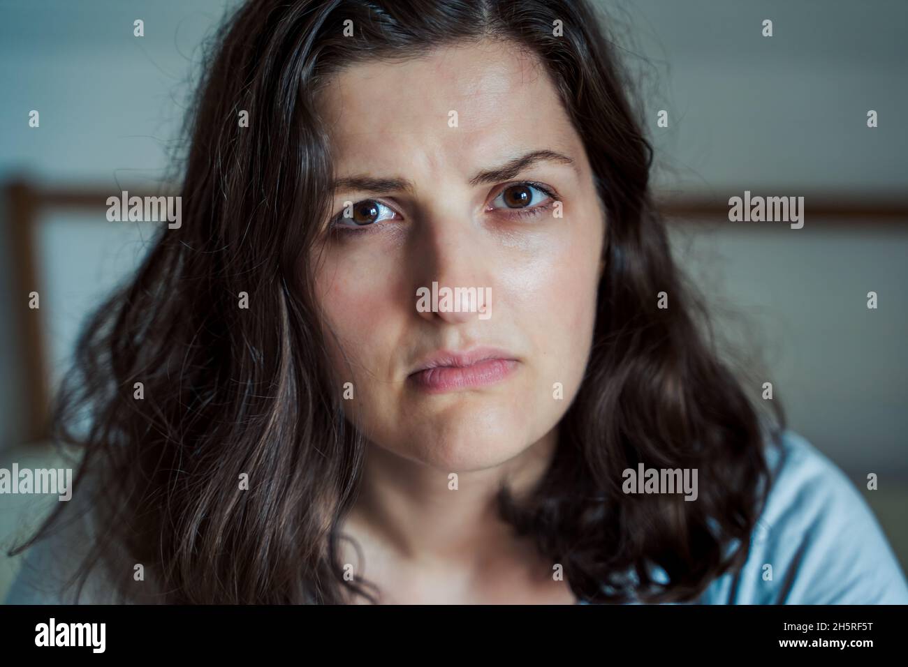 Sad, unhappy woman in depression. Headache, stress, anxiety tension ...