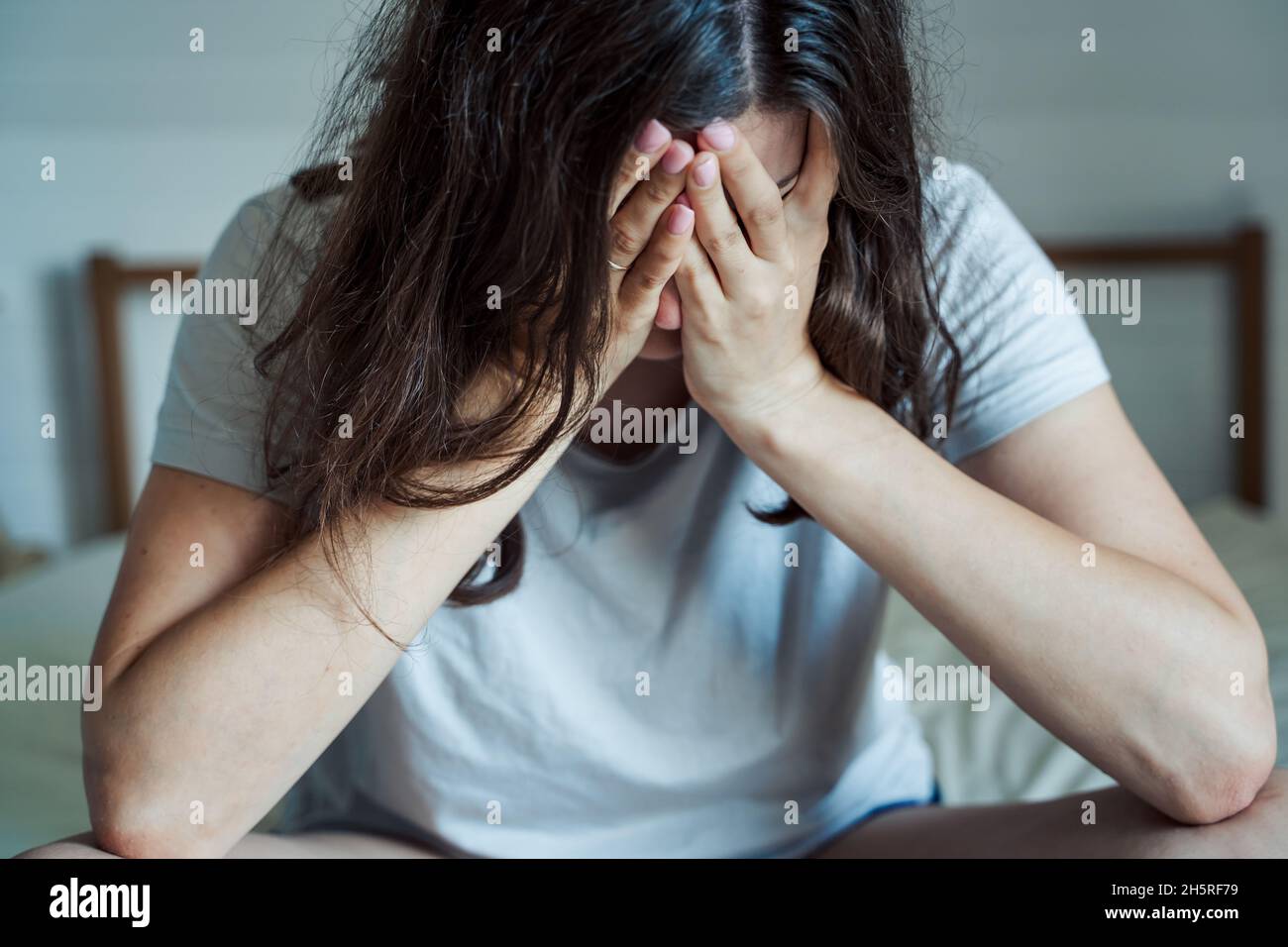 Sad, unhappy woman in depression. Headache, stress, anxiety tension ...