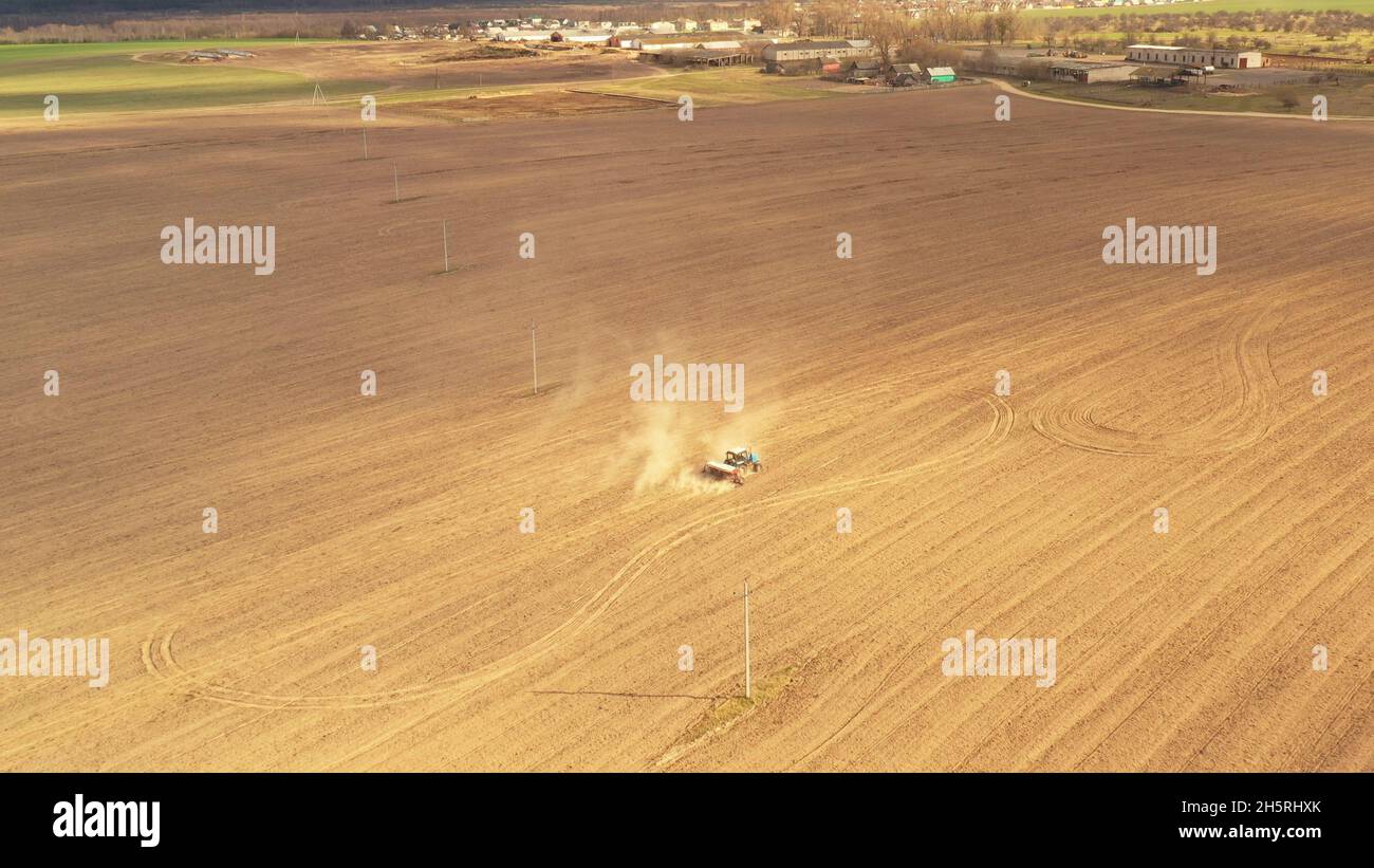 Aerial View. Tractor Plowing Field In Spring Season. Beginning Of ...
