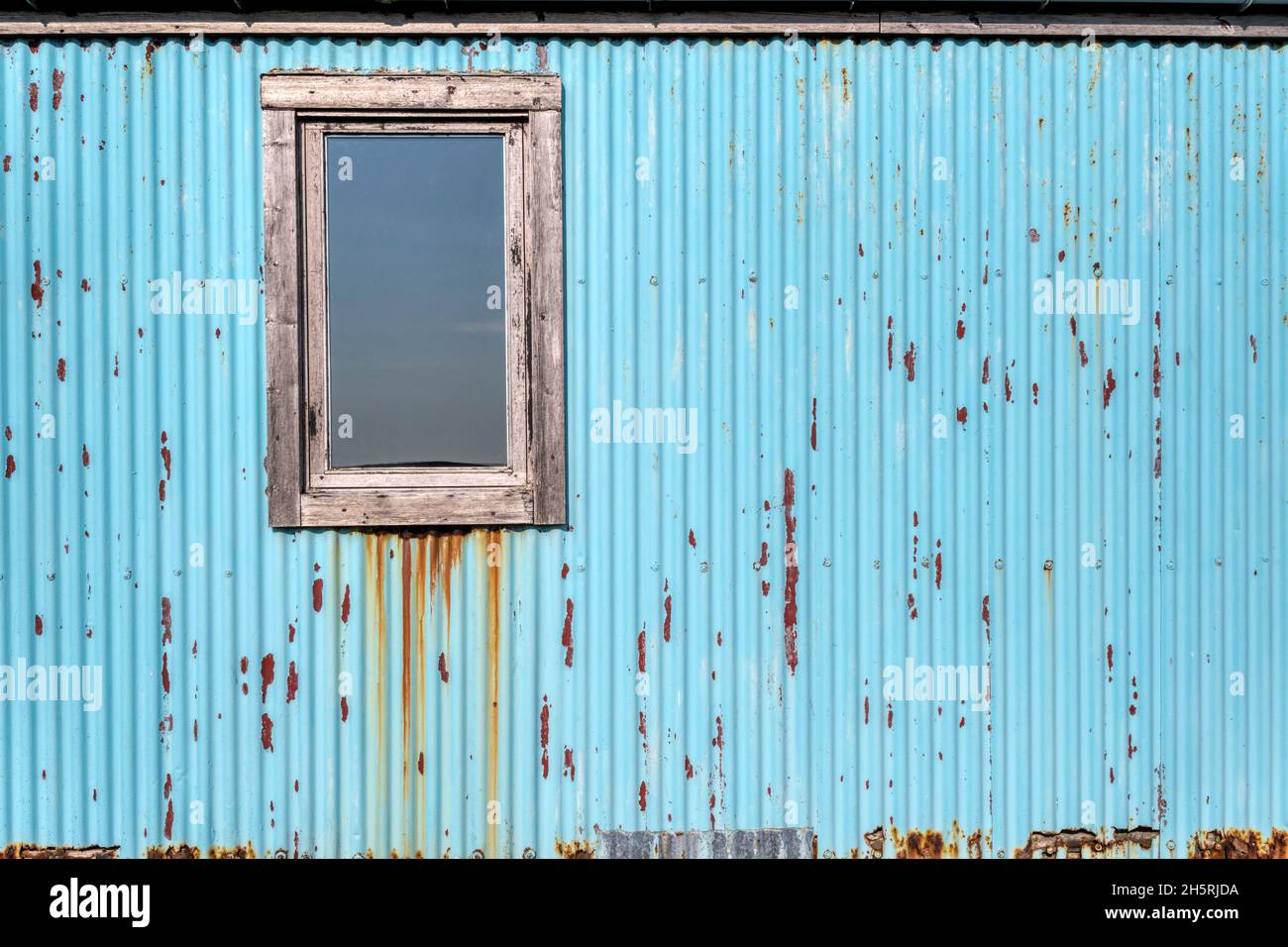 Colourful corrugated iron wall of a building on Yell in the Shetland ...