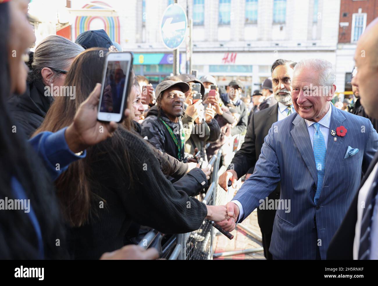 The Prince of Wales (right) meets members of the public as he departs a ...