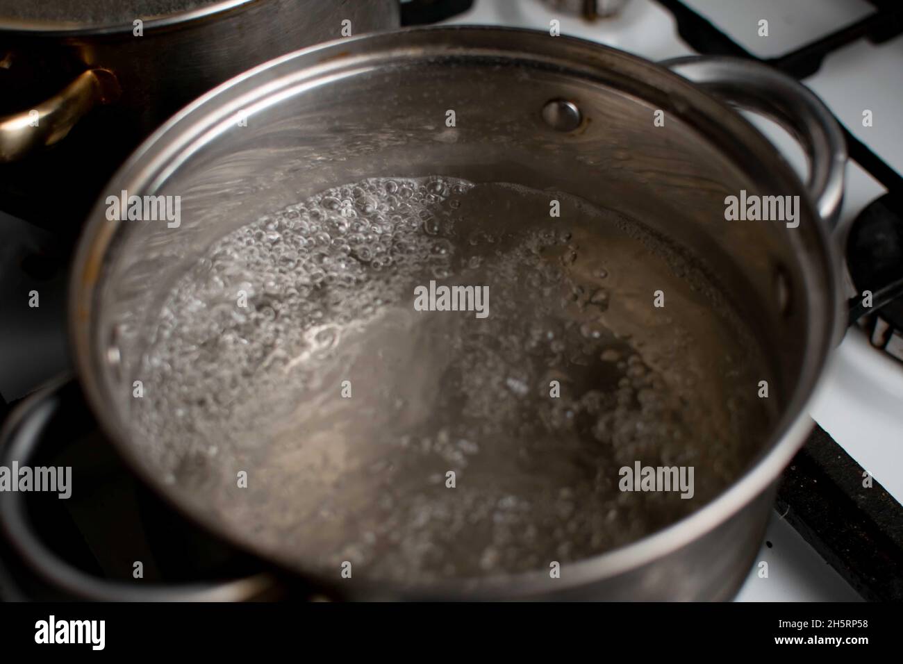 Boiling water in a saucepan. Preparation for cooking boiled food Stock ...