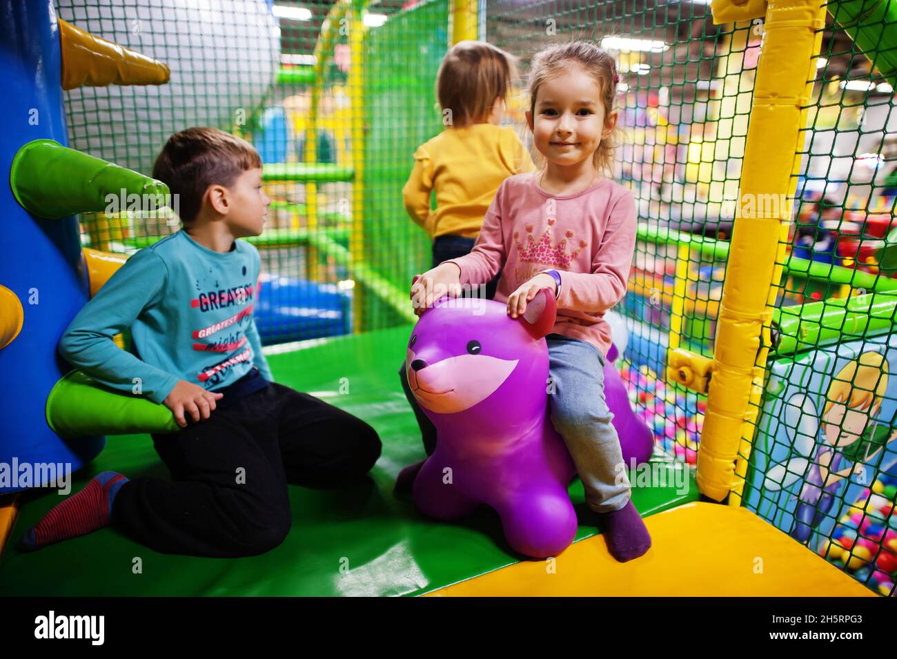 Kids playing in indoor play center. Kindergarten or preschool play room ...