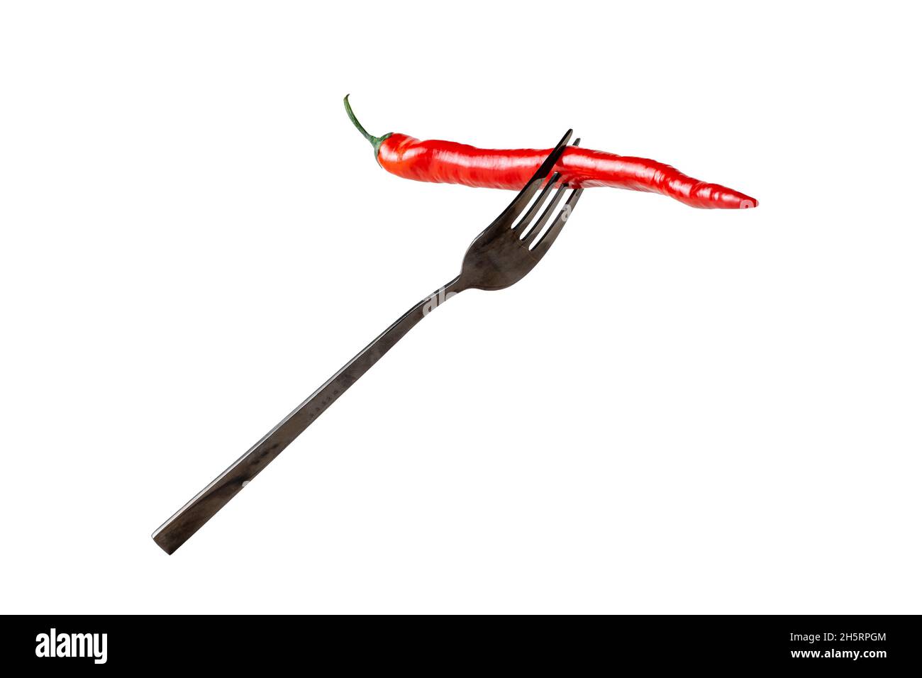 Red hot chili peppers on a fork isolated on a white background. Spicy ...