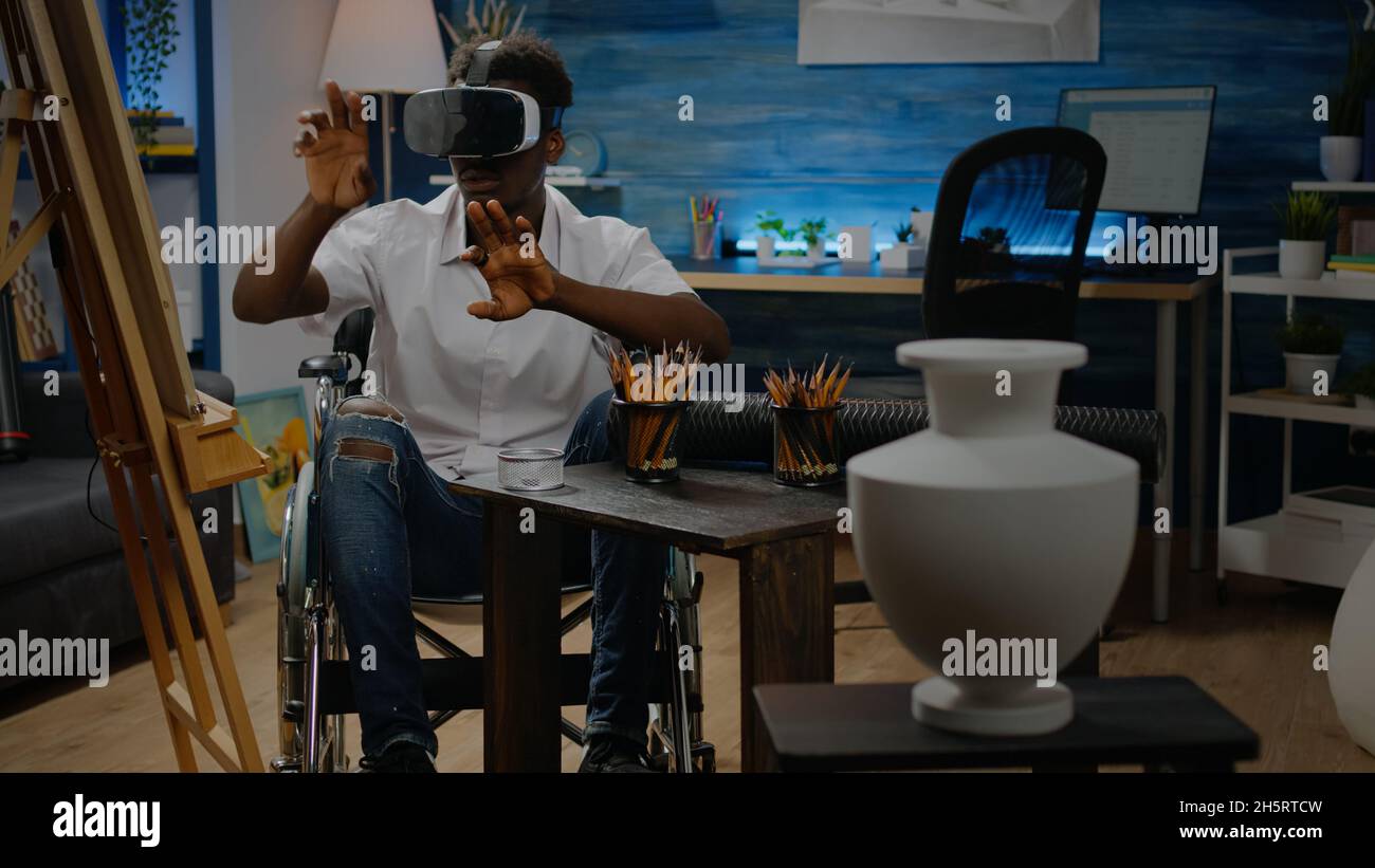 Disabled african american man using vr glasses for inspiration and ...
