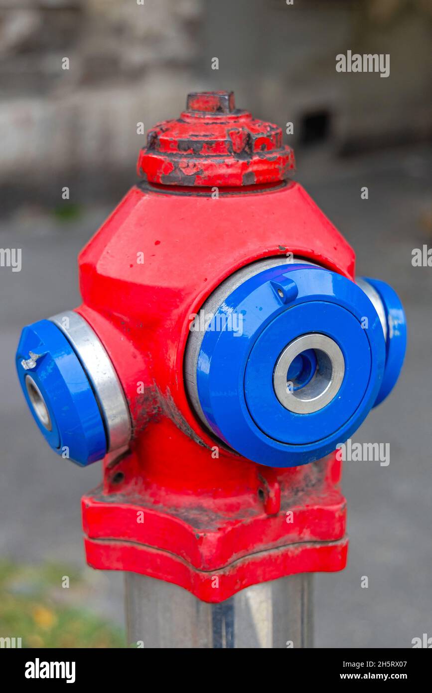 Red Fire Hydrant With Blue Water Valves Stock Photo - Alamy