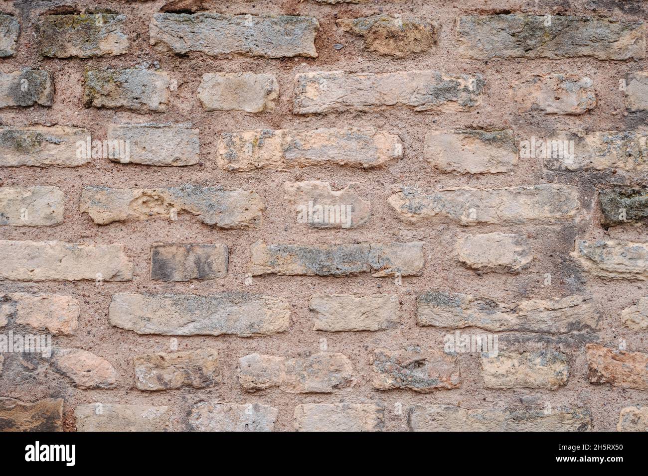 Medieval old european grey and brown brick wall background Stock Photo ...
