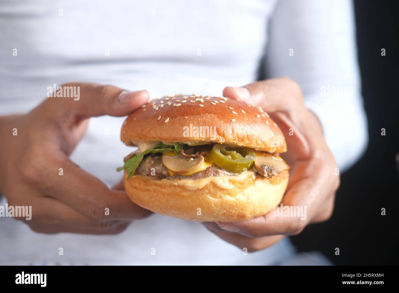 Hungry man eating big hamburger hi-res stock photography and images - Alamy
