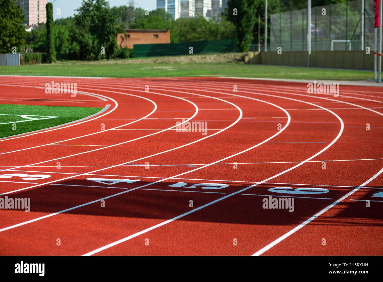 Red treadmill at the stadium with the numbering Stock Photo - Alamy