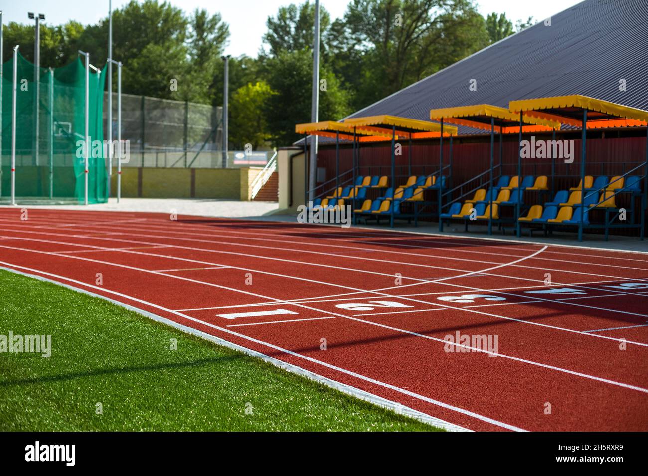 Red treadmill at the stadium with the numbering Stock Photo - Alamy