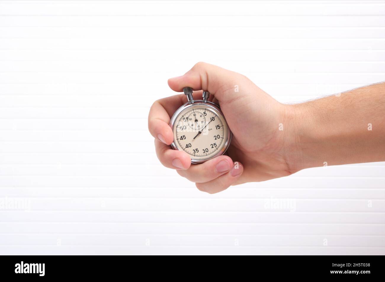 Stopwatch in man hand on white background. Sports, movement and fitness ...