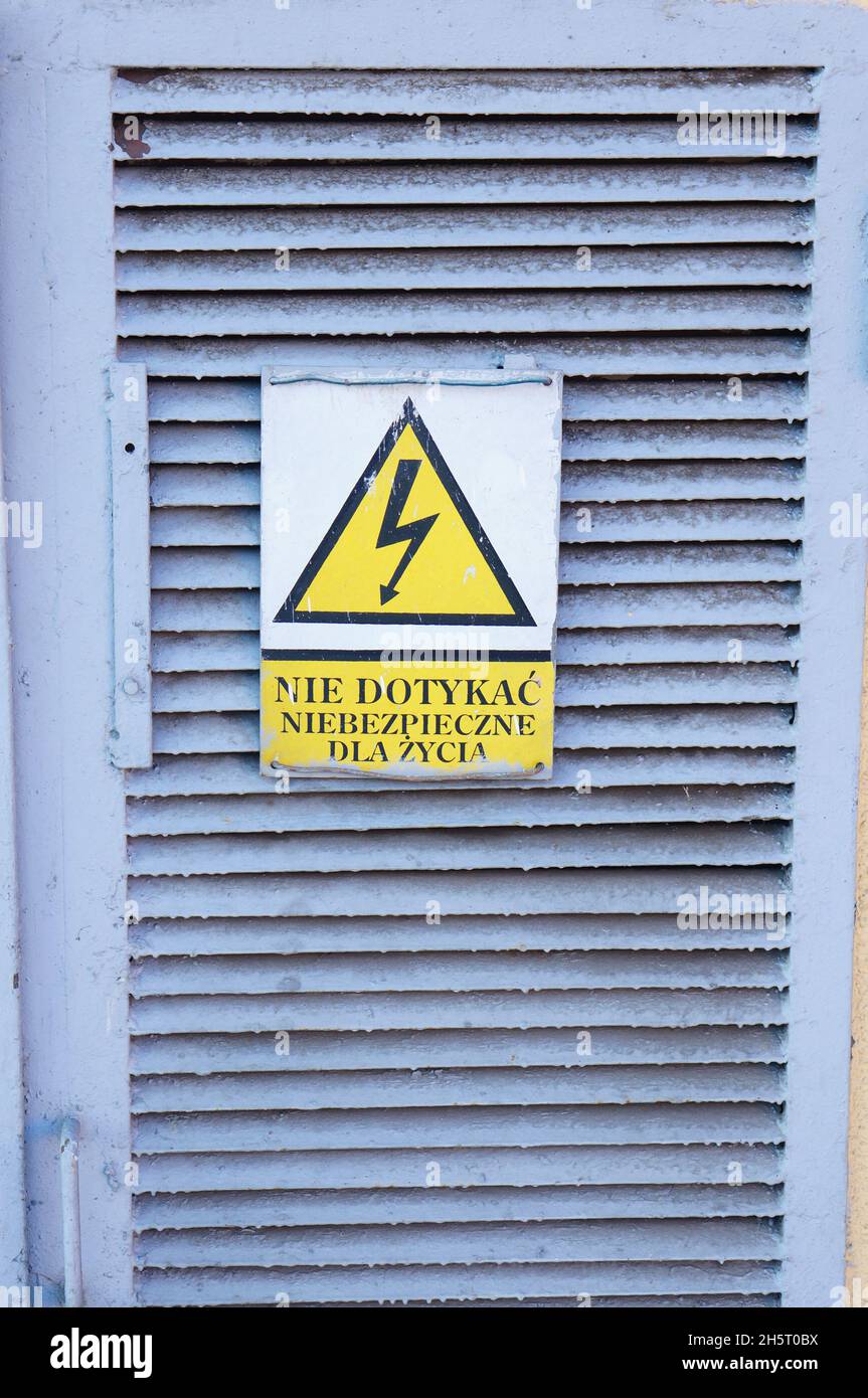 Vertical shot of an electricity warning sign on a door Stock Photo - Alamy