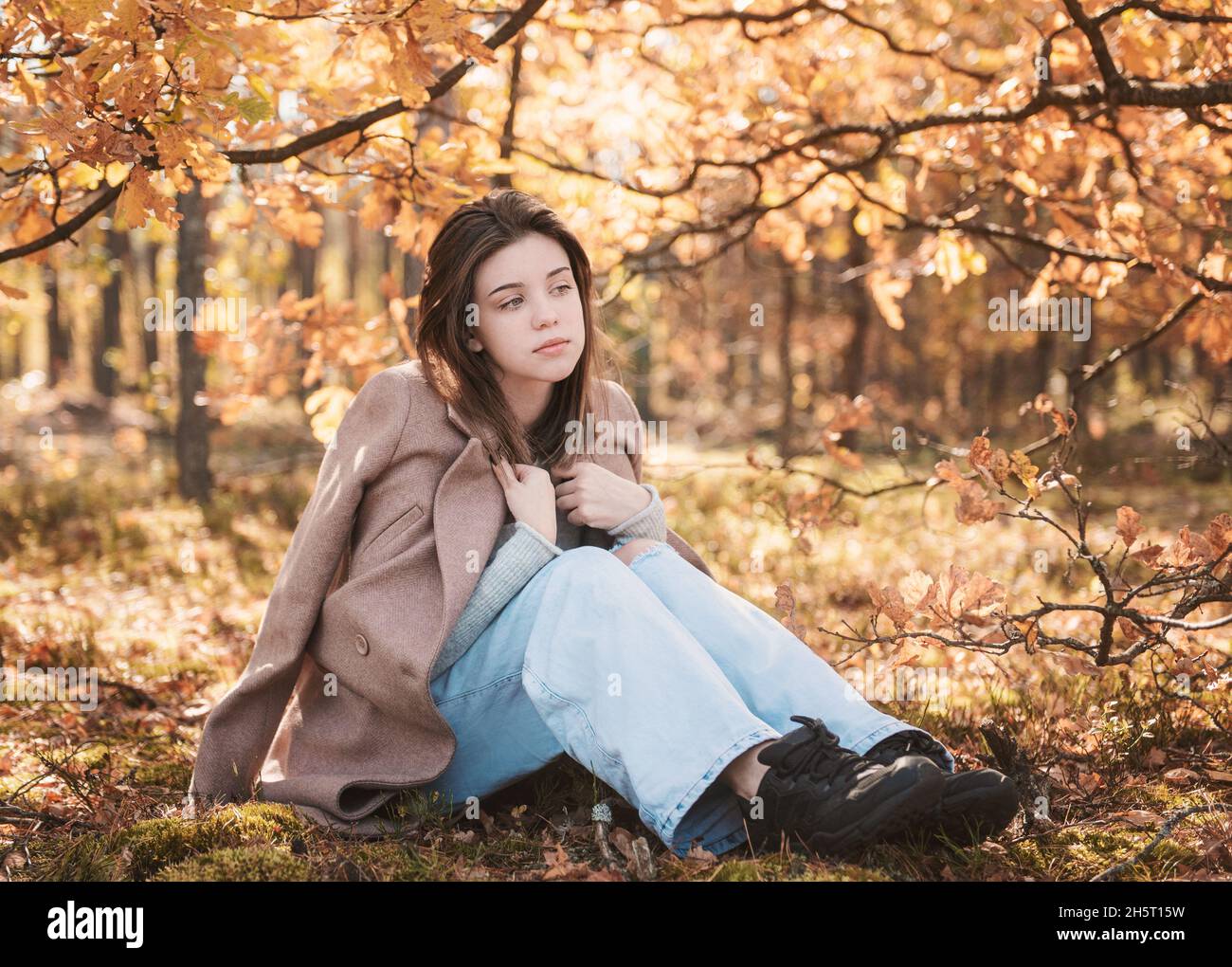 Portrait of a thoughtful and sad girl. Autumn colors . Lifestyle ...